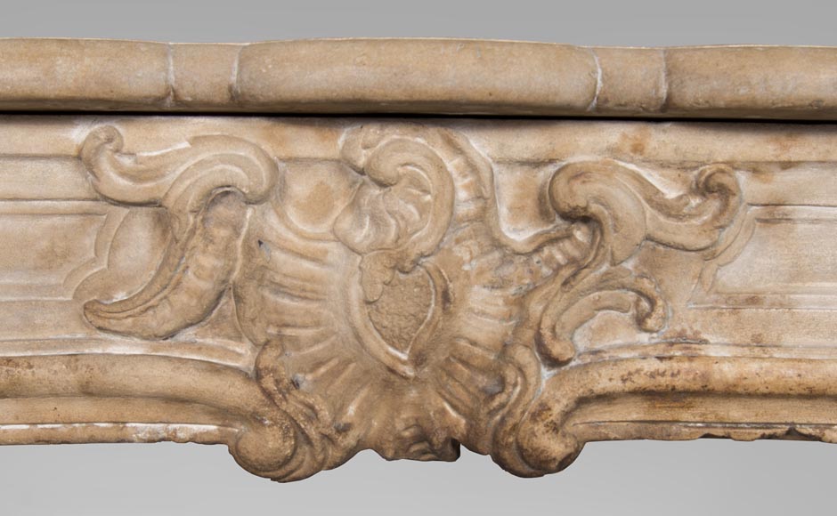 An antique Louis XV style fireplace, made out of stone, with large ...